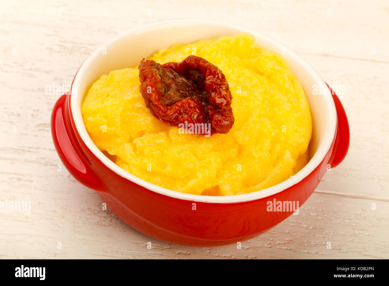 Polenta with dry tomato Stock Photo - Alamy