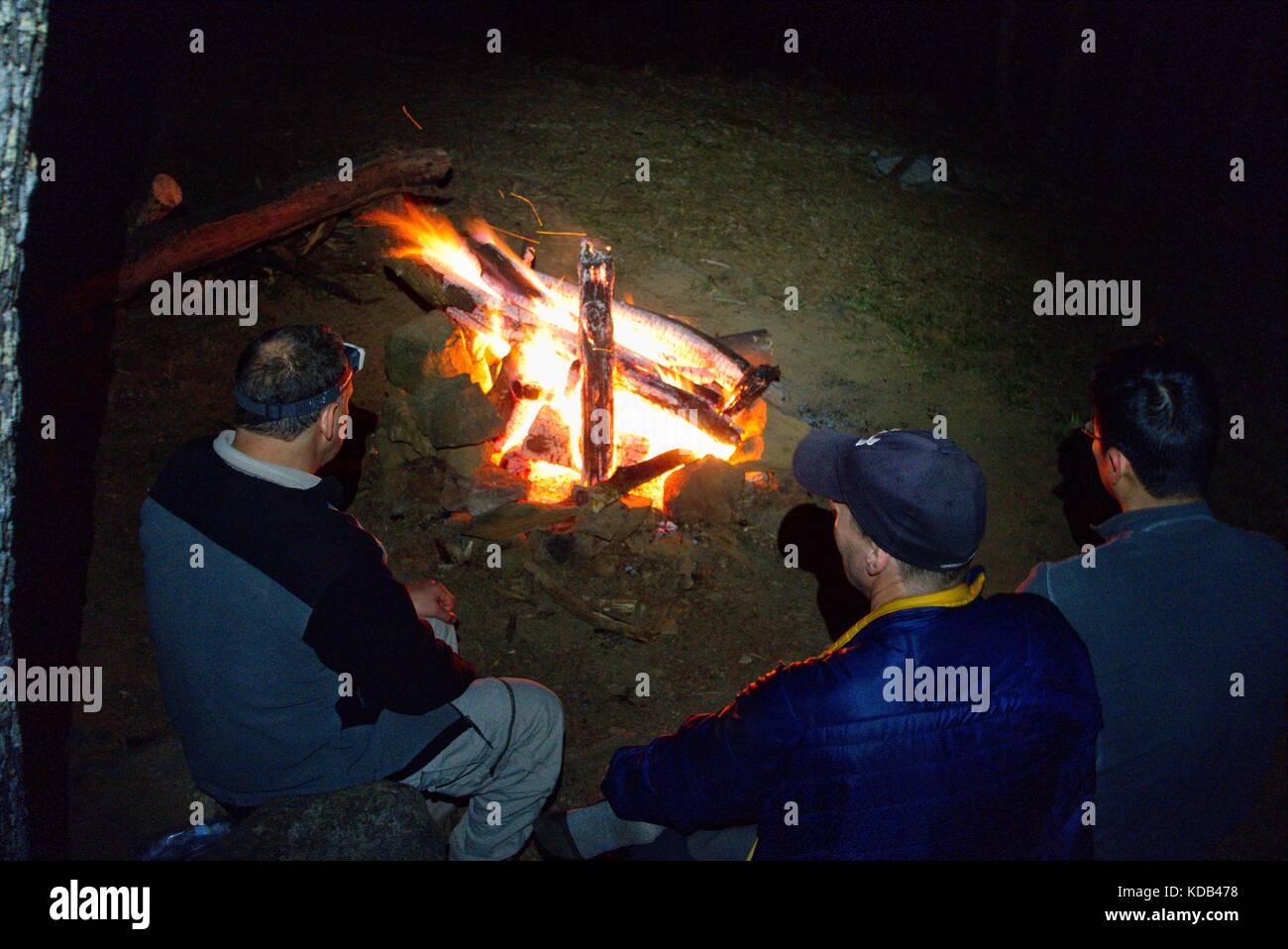 Watching a fire in the backcountry Stock Photo - Alamy