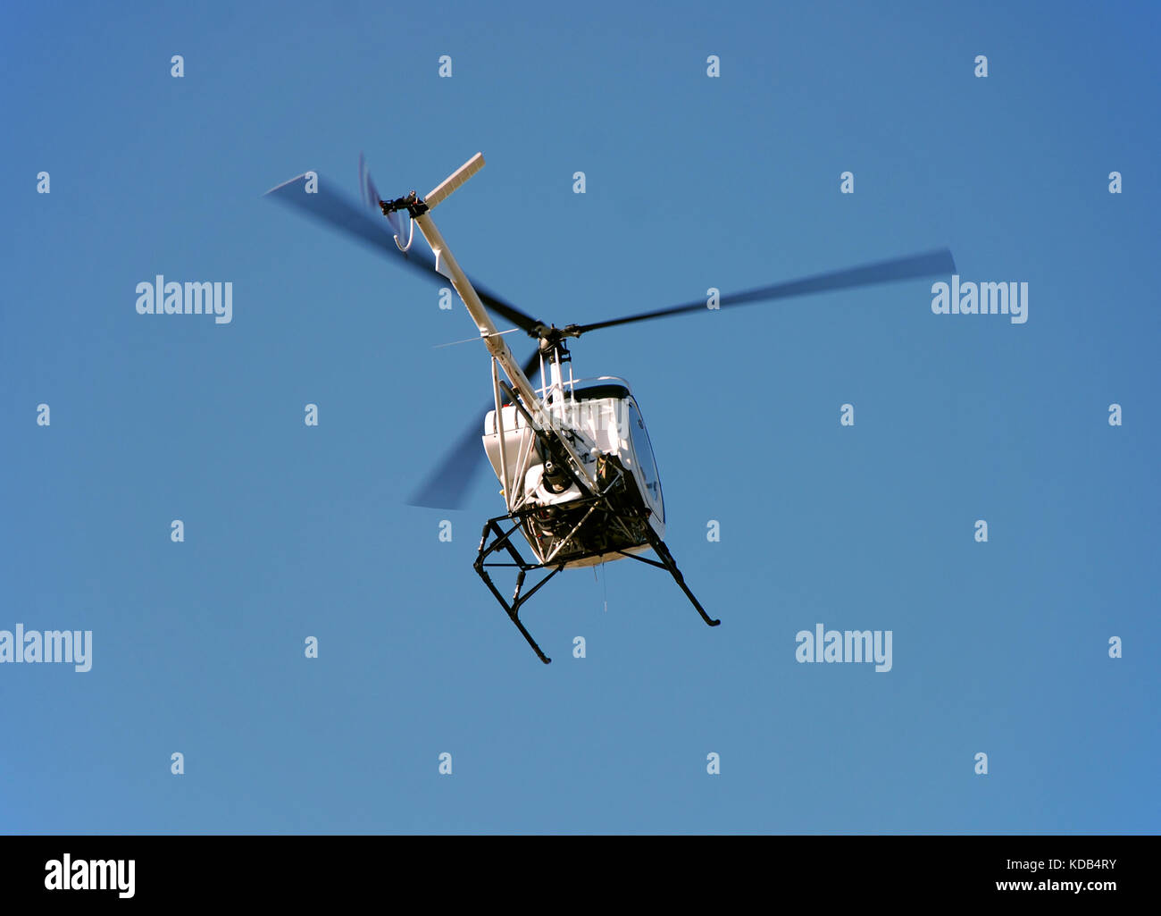 Rear view of light Schweizer helicopter in the sky Stock Photo - Alamy