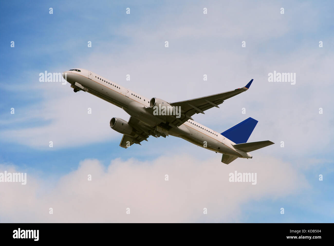 Passenger jet airplane taking off Stock Photo - Alamy