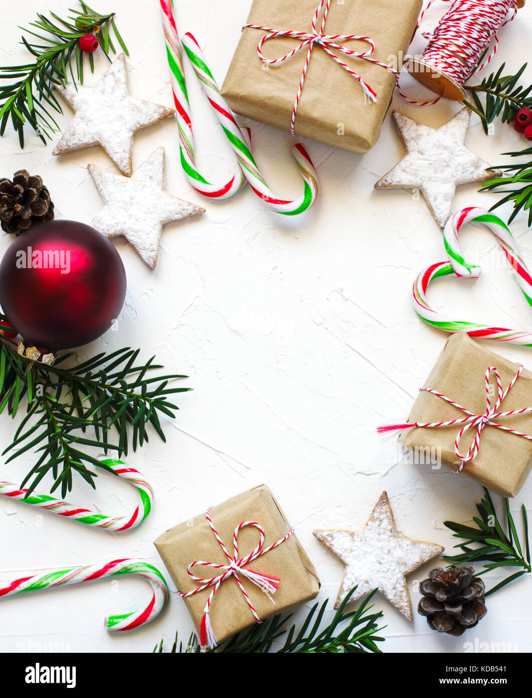 Christmas gift boxes and festive decor on white background, preparation for the holiday Stock ...