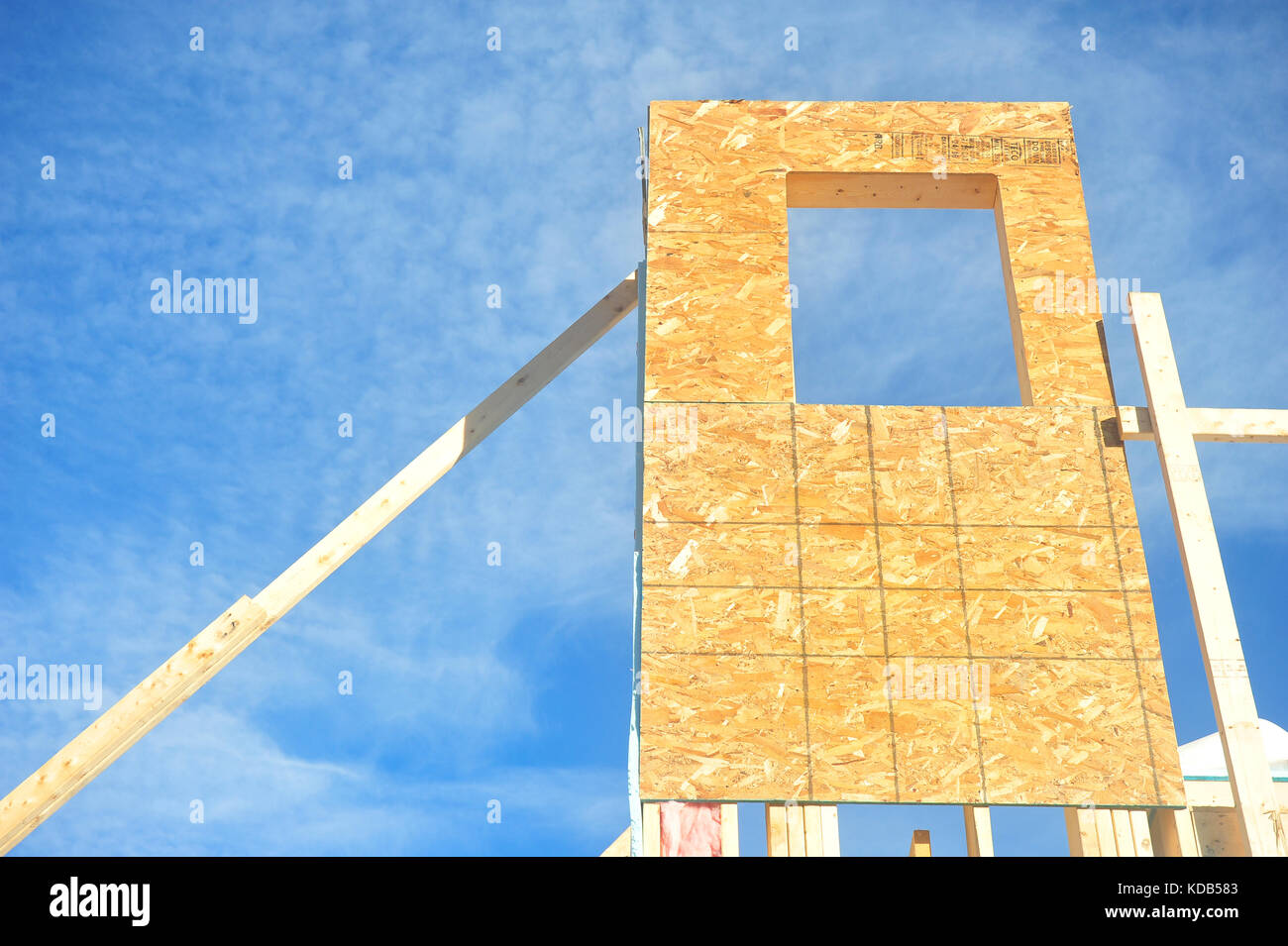 A wooden wall being erected on a building site in London, Ontario in ...