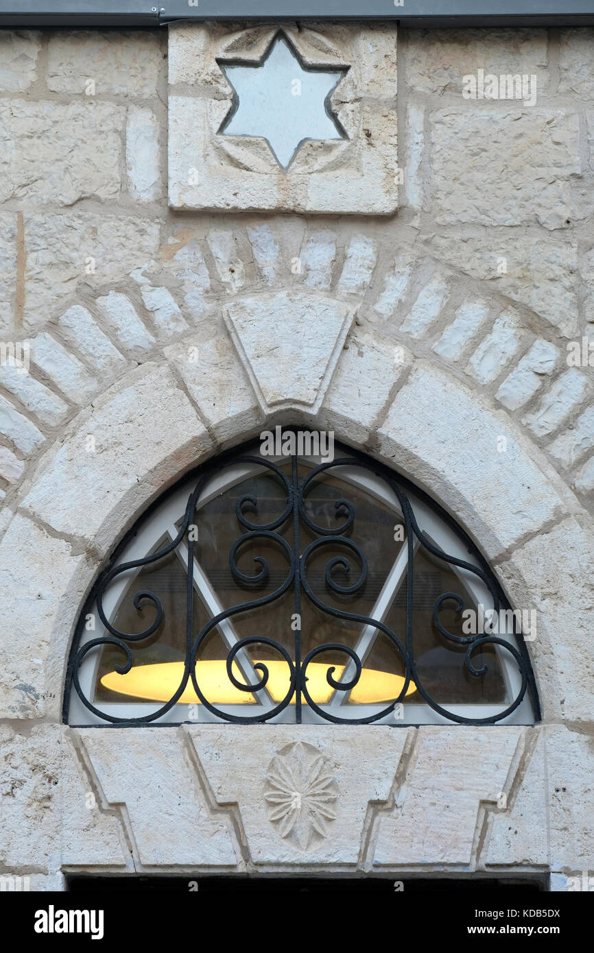 A ventilation window, in the shape of a Star of David, is an arched ...