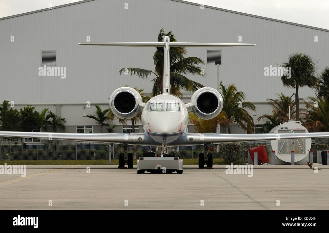 Luxury business jet on the ground front view Stock Photo - Alamy