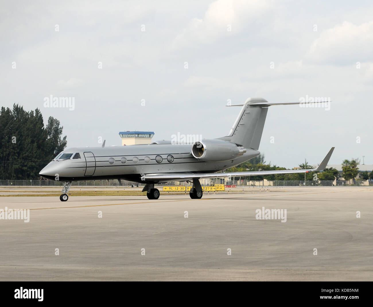 Luxury private jet in gray color arriving at destination Stock Photo ...
