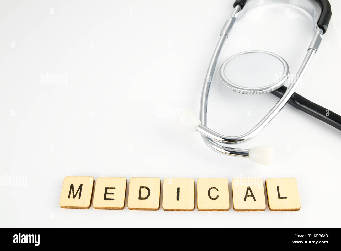 The word medical written in letter tiles with a black stethoscope ...
