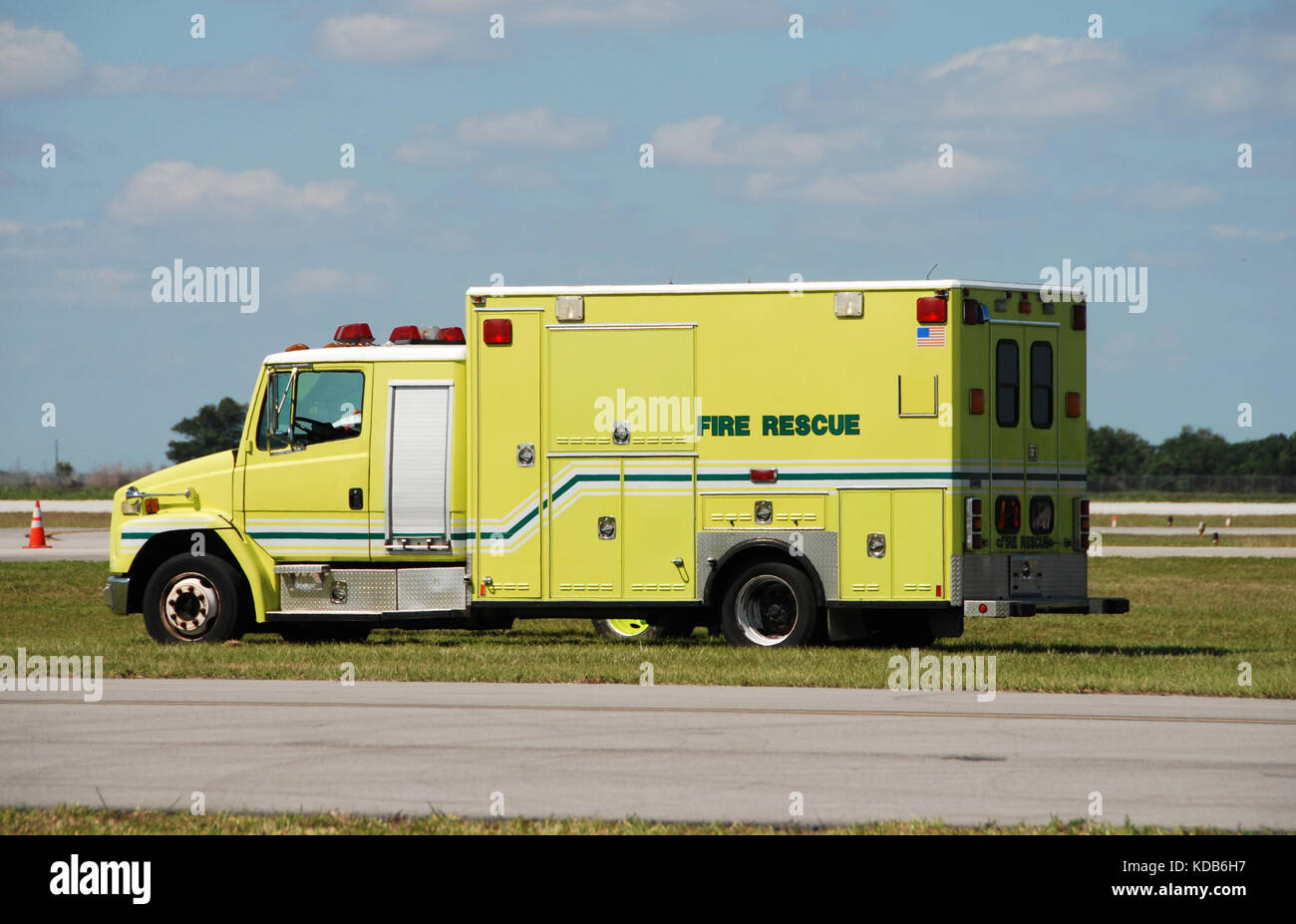 Yellow colored fire rescue truck parked ina field Stock Photo - Alamy