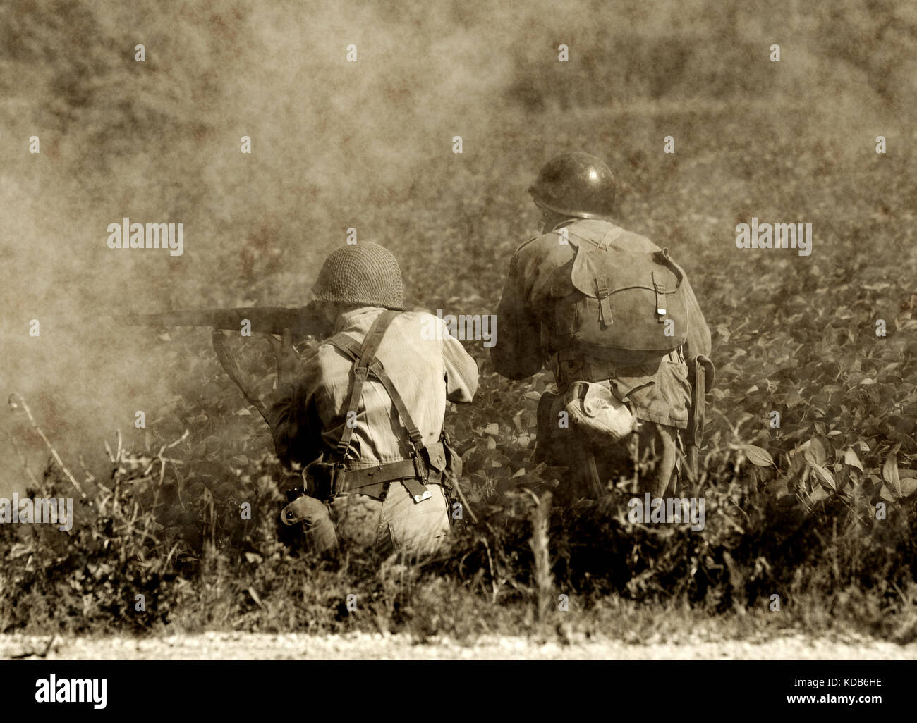 Two soldiers ina World War II era battlefield Stock Photo - Alamy