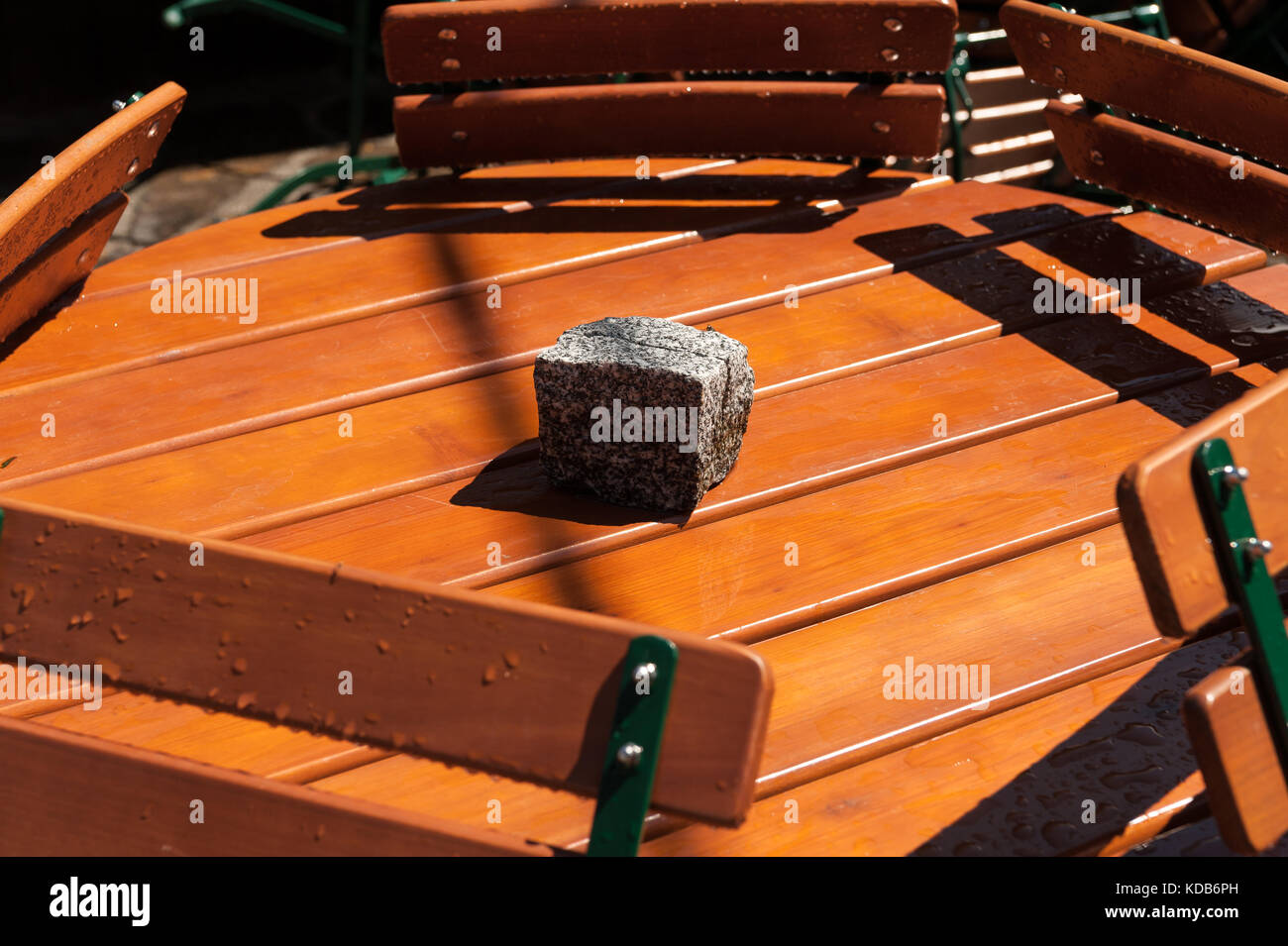 Closeup of a restaurant table with a granite stone in the middle Stock ...