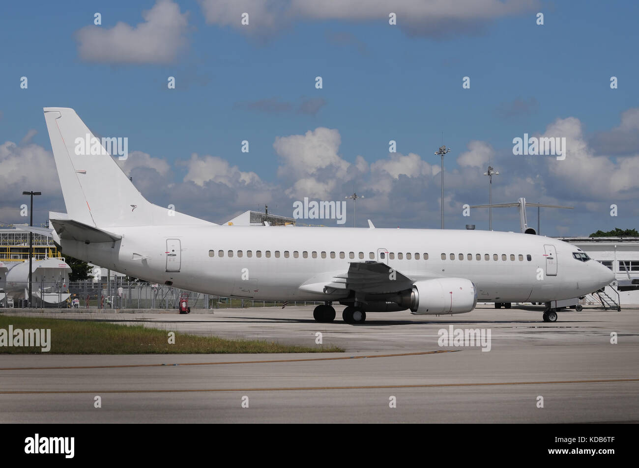 Unmarked passenger jet airplane side view Stock Photo - Alamy