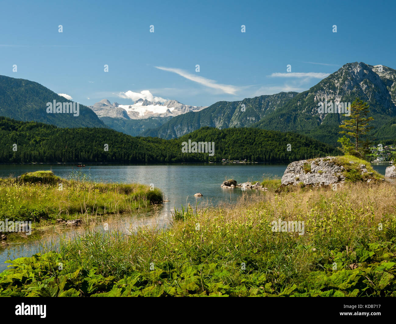 Altausseer See in summer on a sunny day, Dachstein, snowy mountain in ...