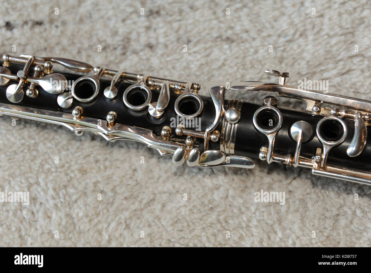 Detail of a Clarinet lying on a woolen carpet Stock Photo - Alamy