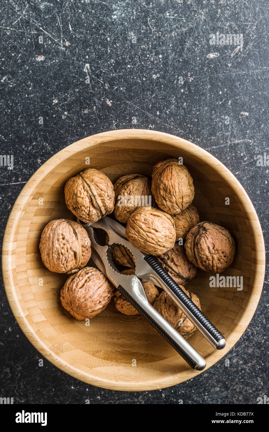 Tasty dried walnuts with nutcracker Stock Photo - Alamy