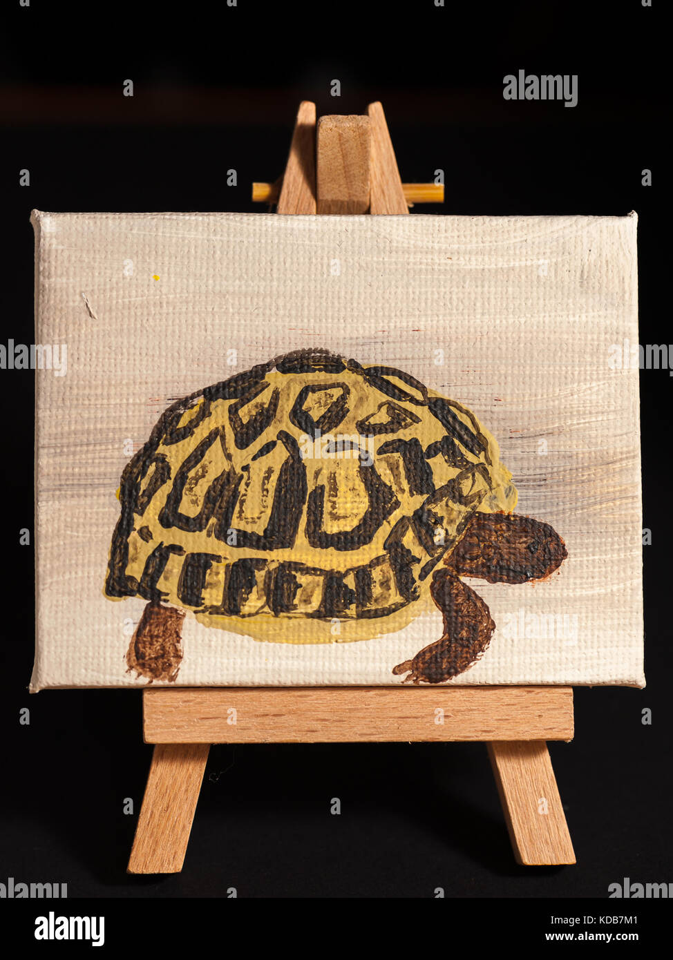 Closeup of a small child's painting of a tortoise on an easel Stock ...