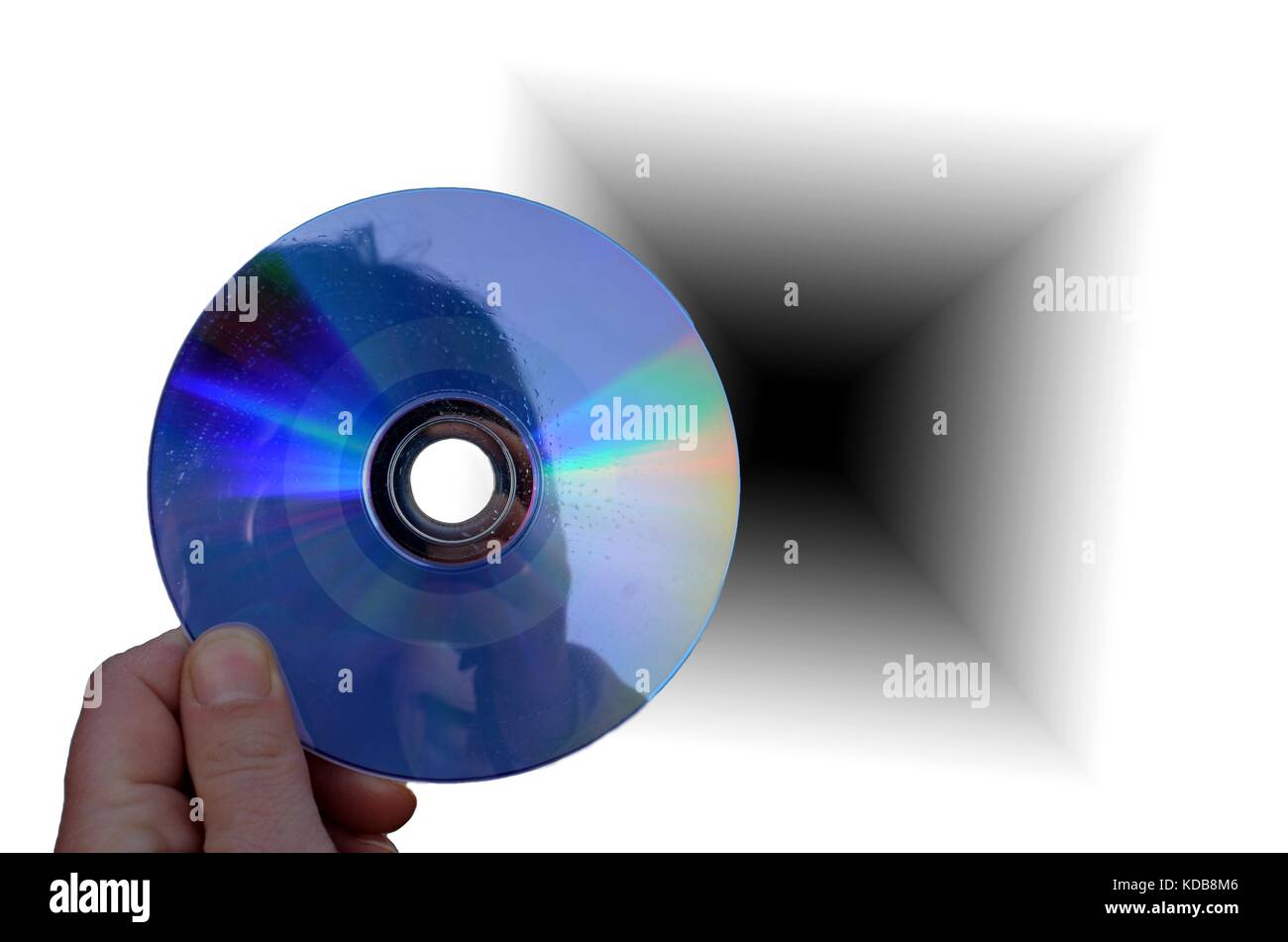 hand holding cd or dvd disc close up and black hole background Stock ...