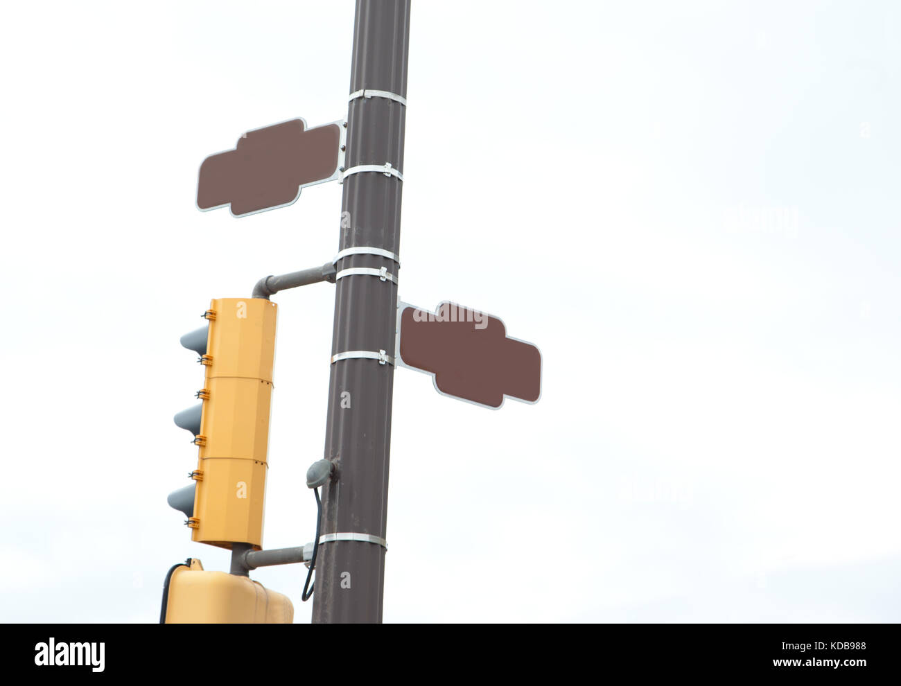 corner or intersection with traffic lights and two brown street signs ...