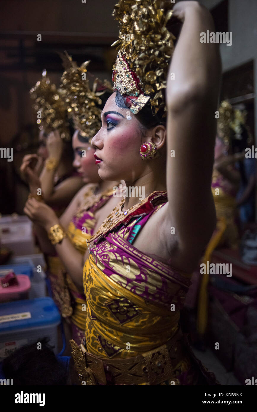 A group of traditional Balinese Legong dancers preparing themselves ...