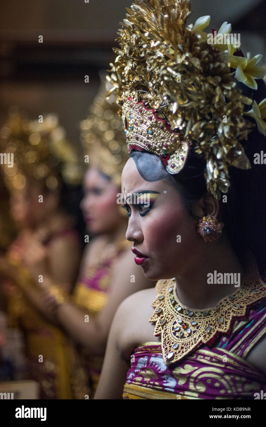 A female traditional Legong dancer getting ready before the show, Ubud ...