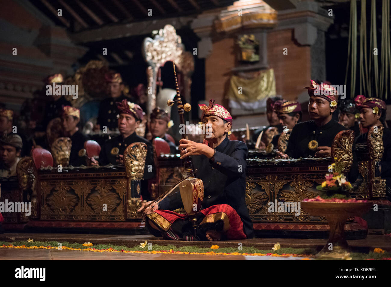 A traditional balinese music band performing at a Legong dance show ...