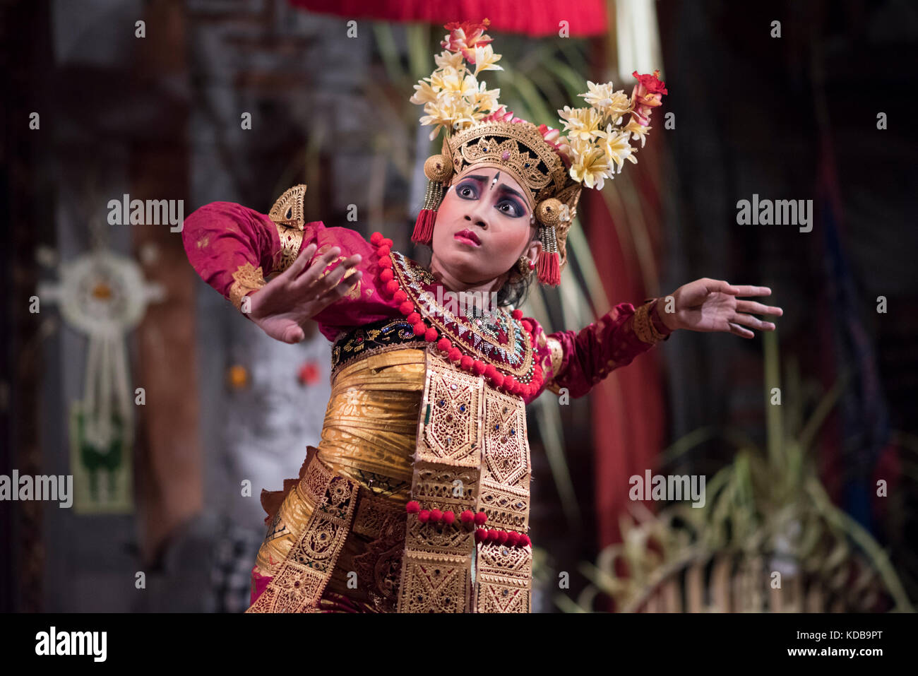 Traditional Balinese Legong dancer performing in a theater in Ubud ...