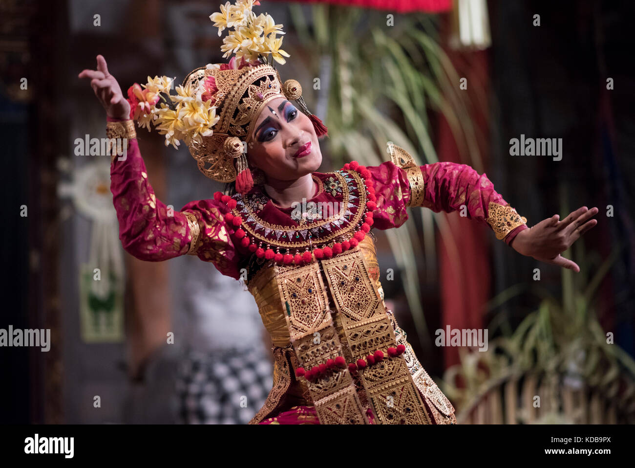 Traditional Balinese Legong dancer performing in a theater in Ubud ...