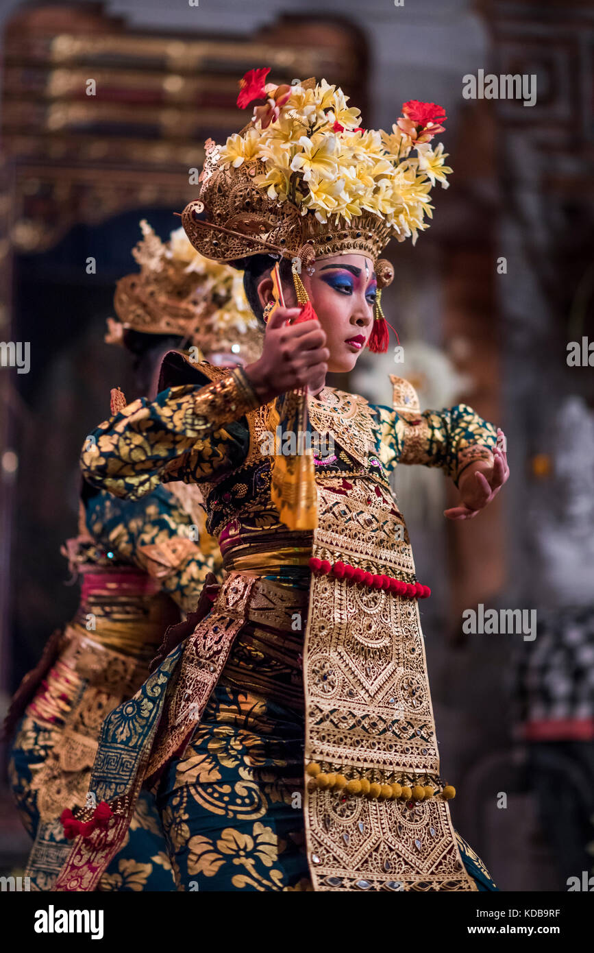 Traditional Balinese Legong dancer performing in a theater in Ubud ...