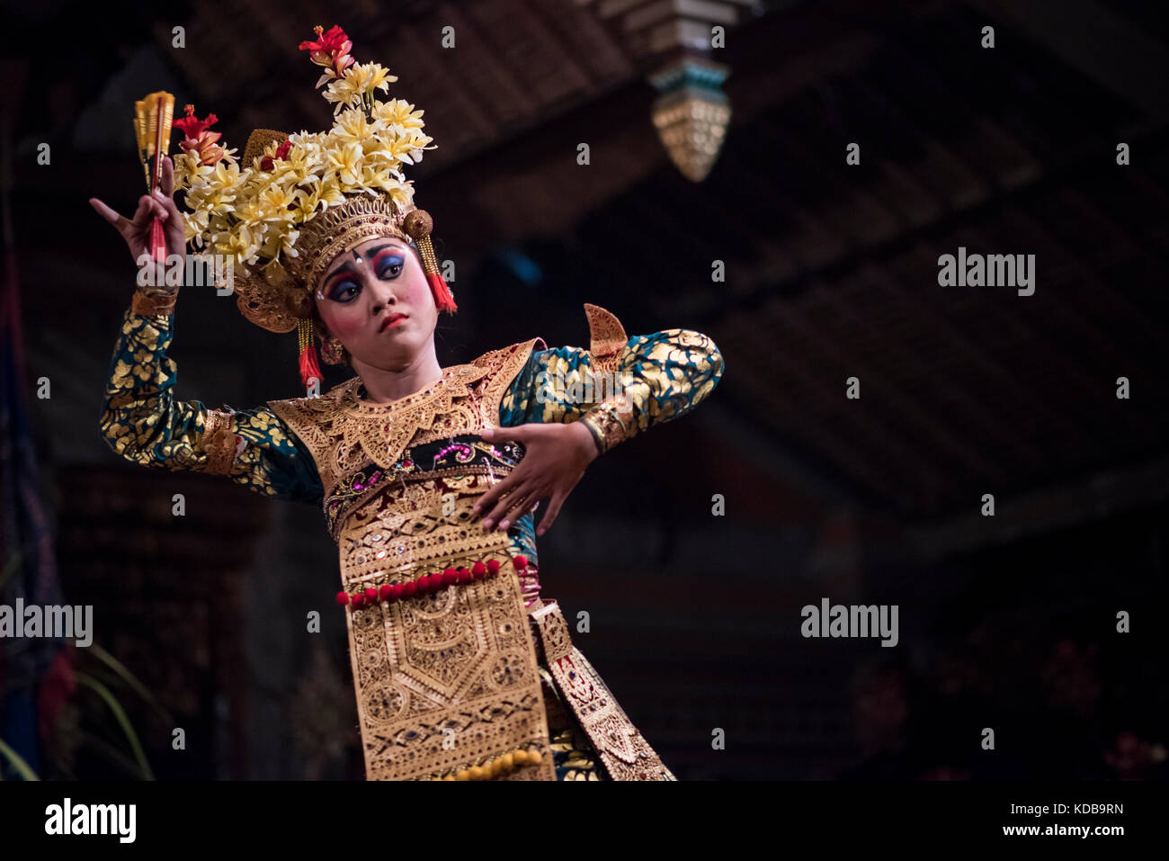 Traditional Balinese Legong dancer performing in a theater in Ubud ...