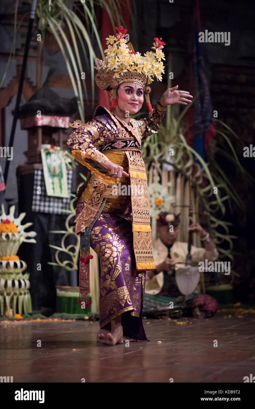 Traditional Balinese Legong dancer performing in a theater in Ubud ...