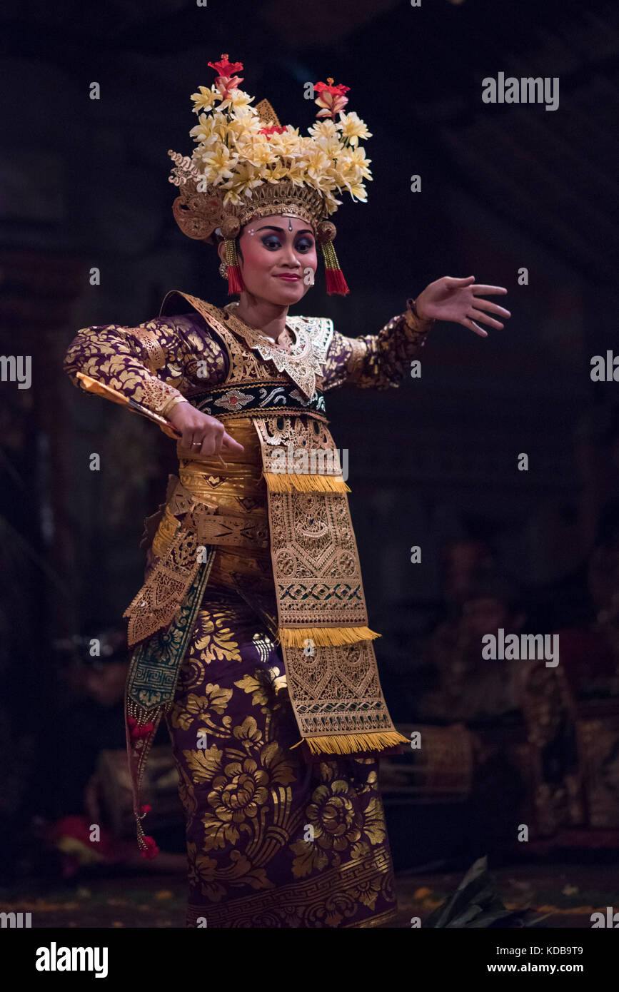 Traditional Balinese Legong dancer performing in a theater in Ubud ...