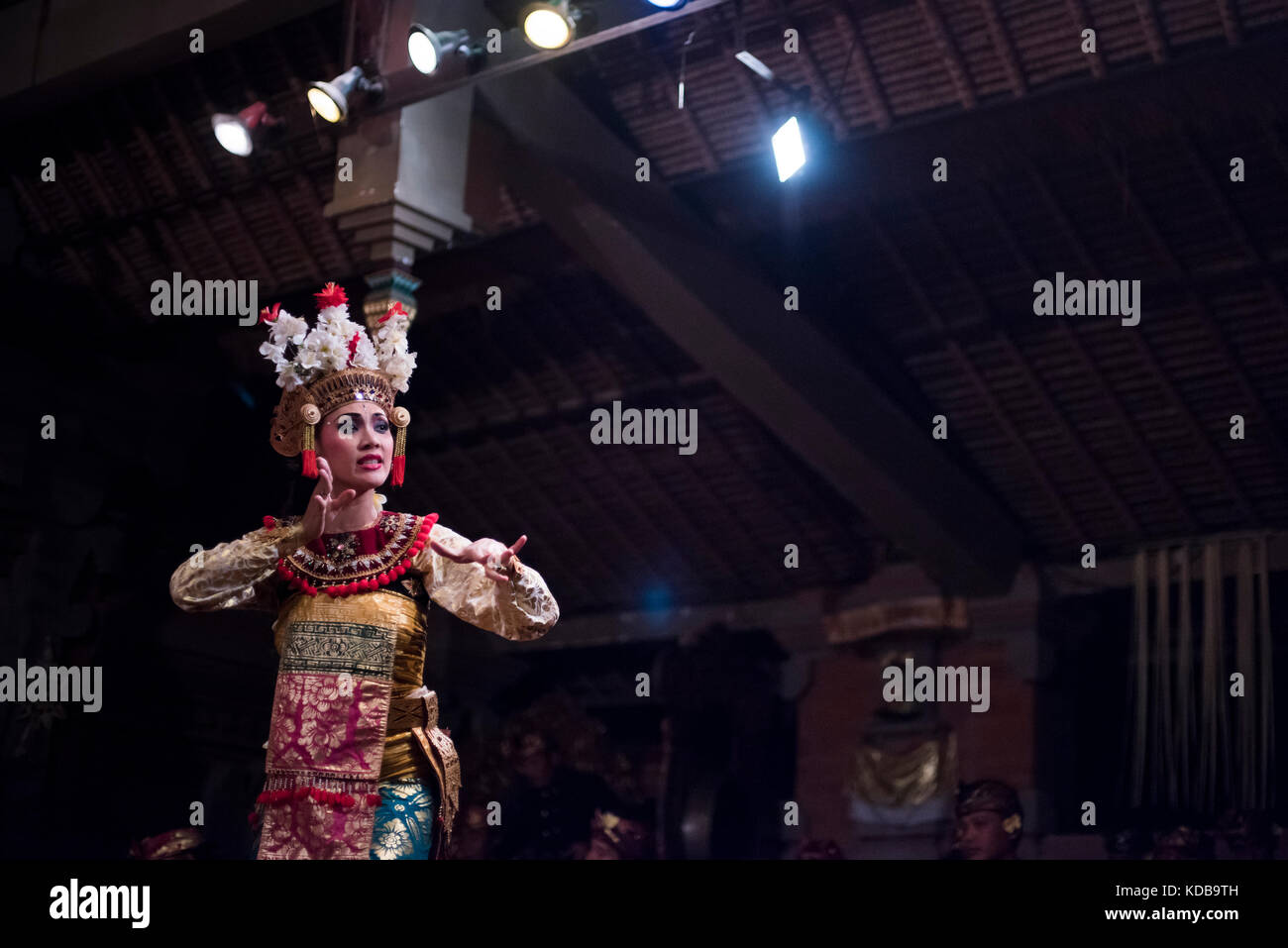 Traditional Balinese Legong dancer performing in a theater in Ubud ...