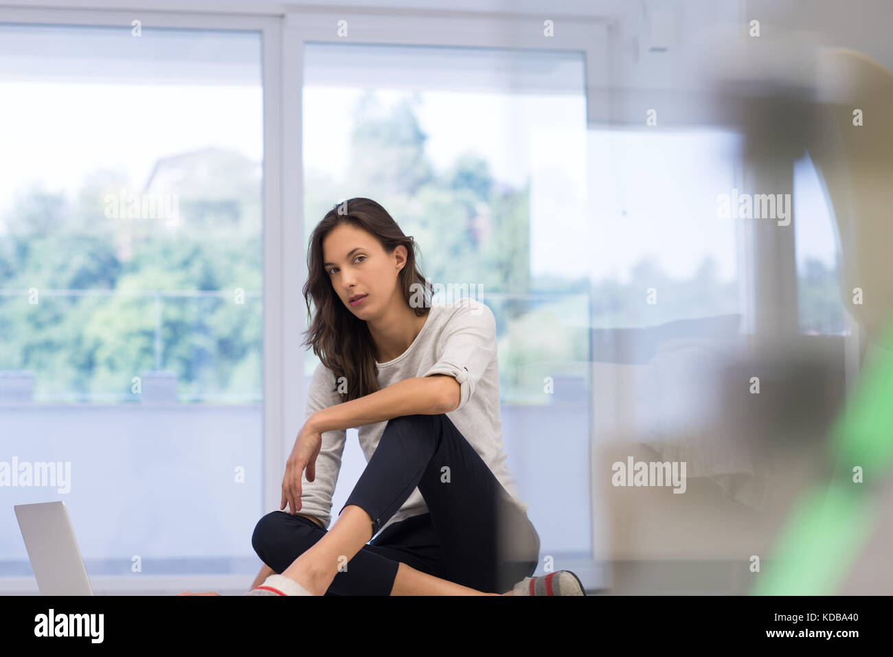 beautiful young women using laptop computer on the floor at home Stock ...