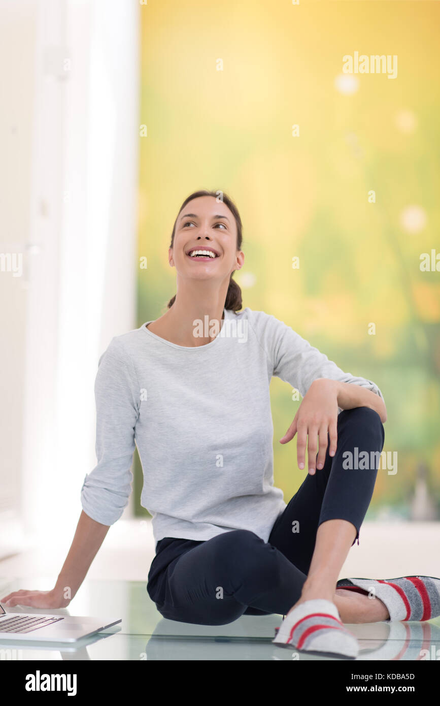 beautiful young women using laptop computer on the floor at home Stock ...