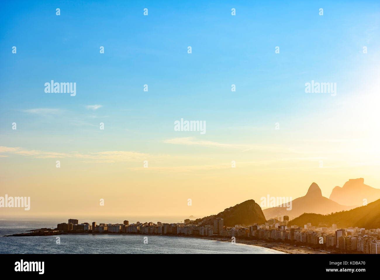 Copacabana beach in Rio de Janeiro during sunset with its buildings and ...