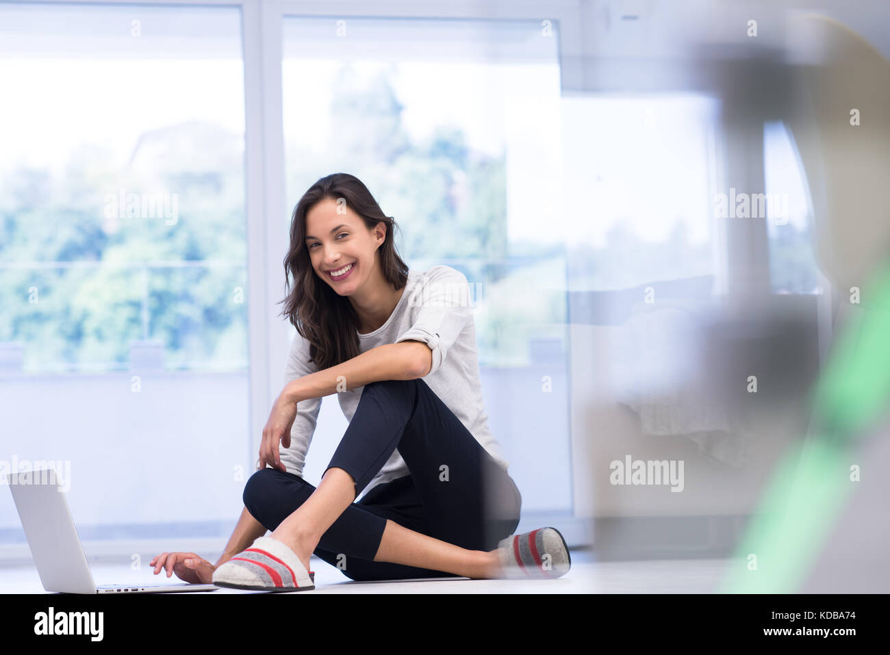 beautiful young women using laptop computer on the floor at home Stock ...