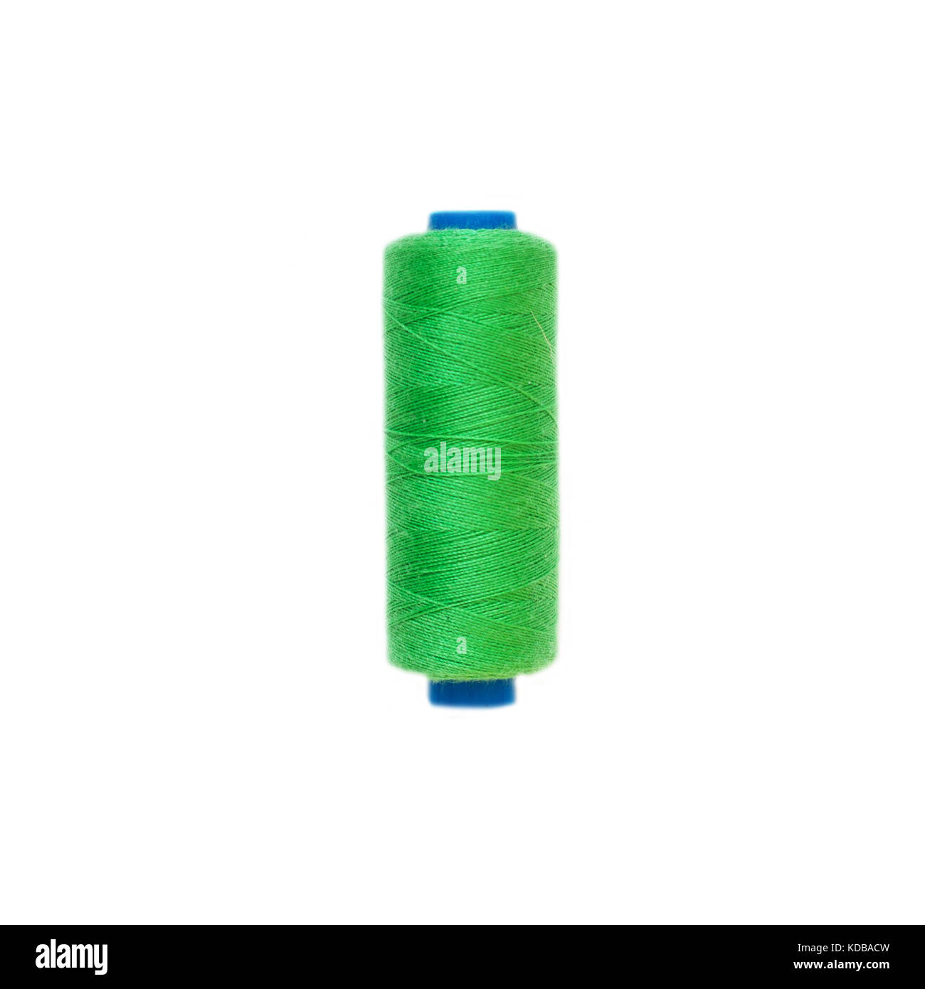 The coil with green threads. White background Stock Photo - Alamy