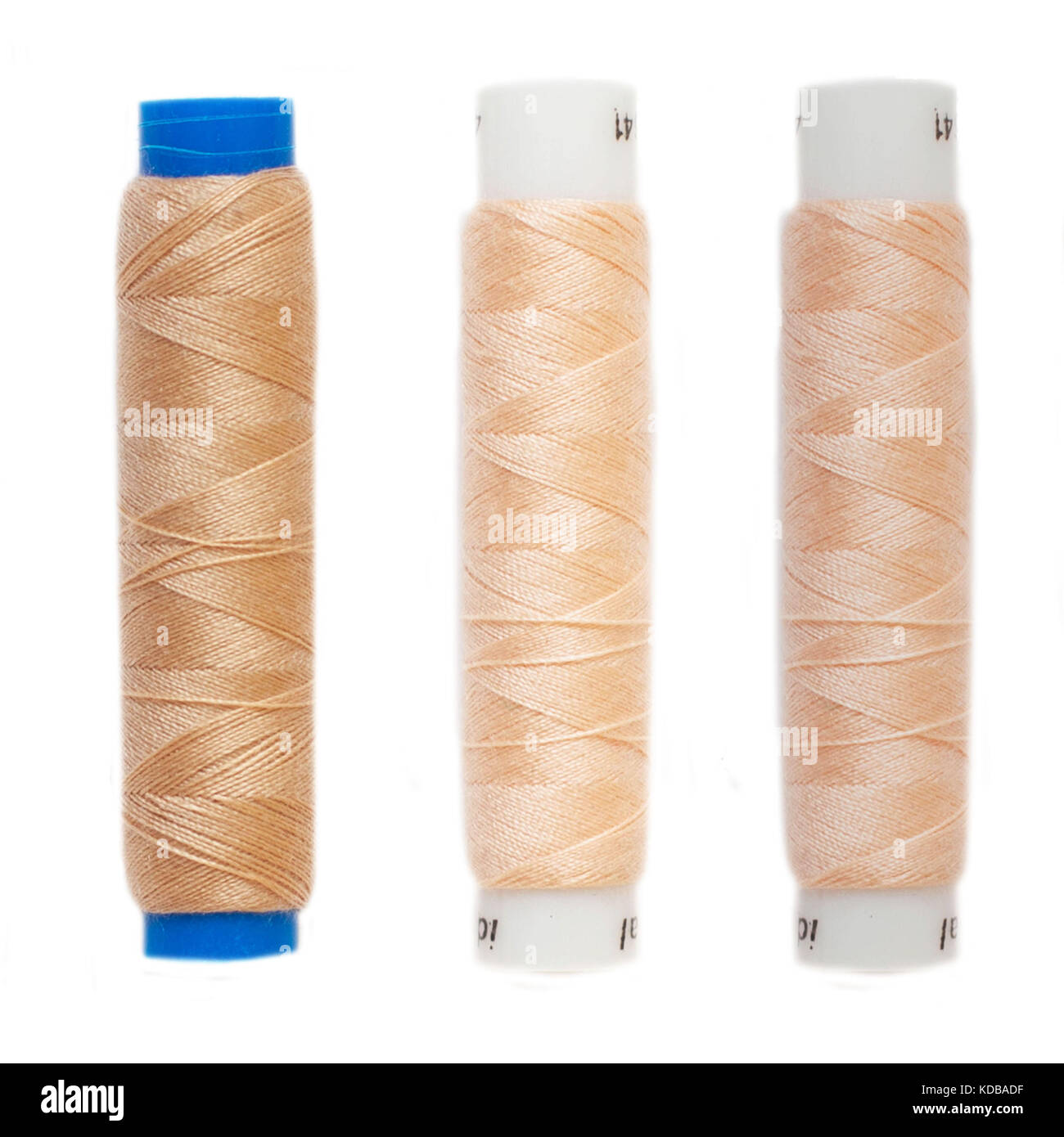 Beige thread. Isolated. White background Stock Photo - Alamy