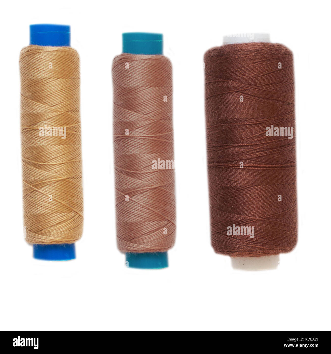 Beige and brown thread. Isolated. White background Stock Photo - Alamy
