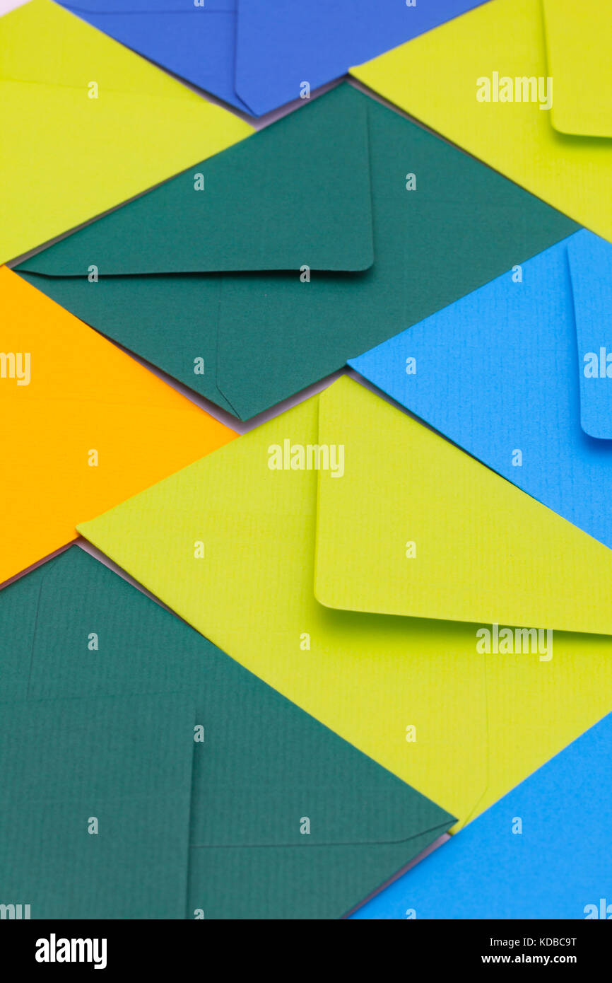 Different colored envelopes on the table Stock Photo - Alamy