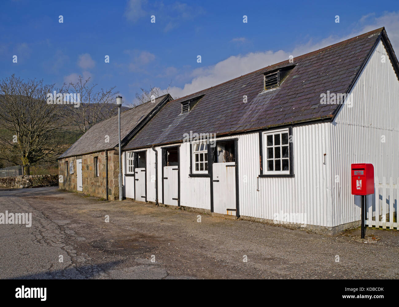 Picturesque old stables next to red post box at Achfary, on the Duke of ...