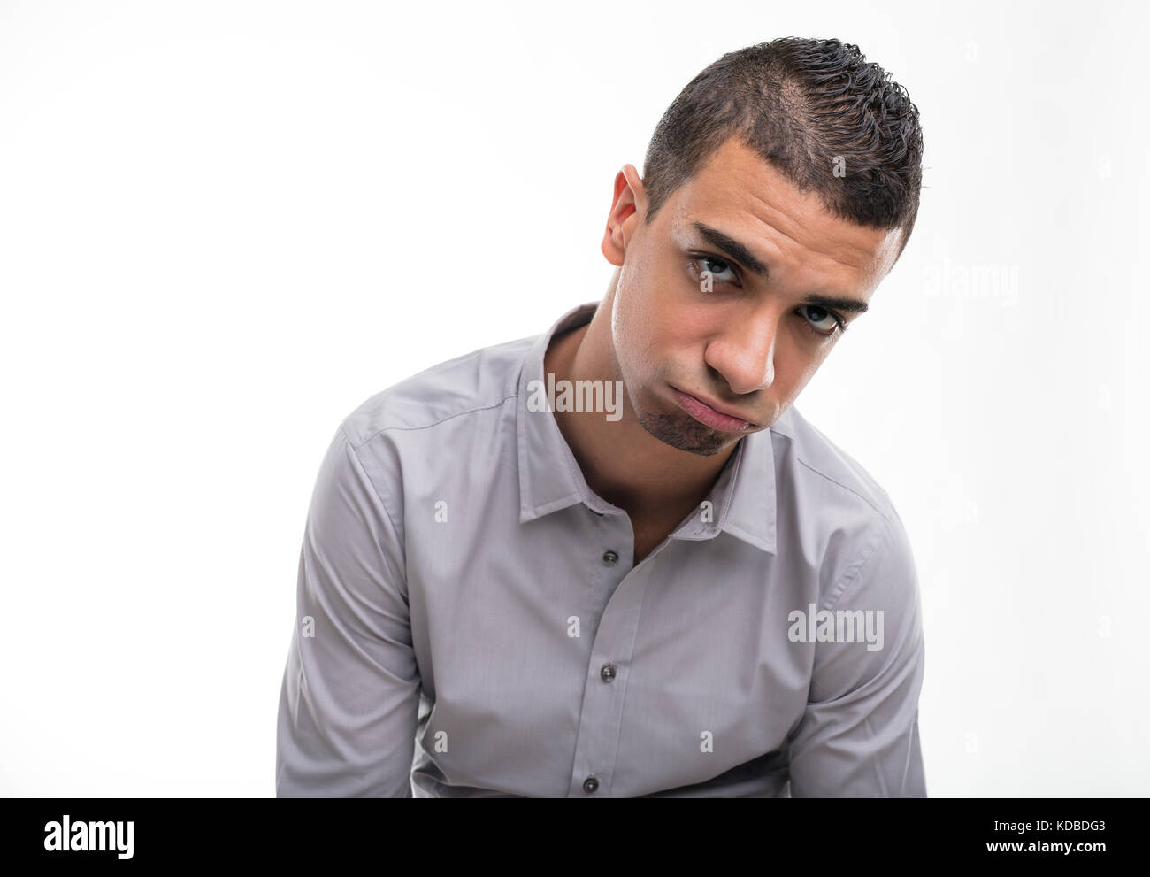 Portrait of young hunched disappointed man isolated against white ...