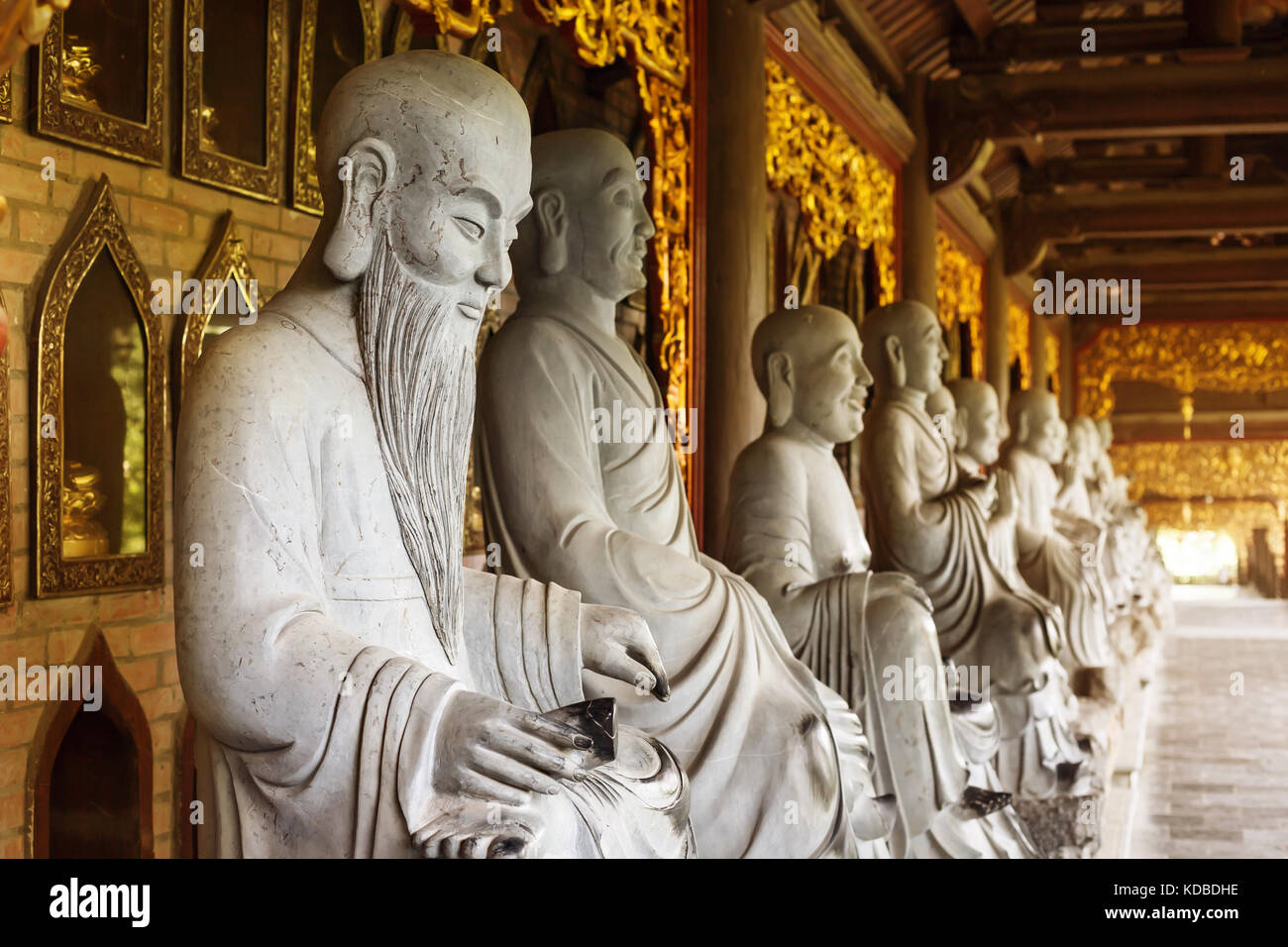 Asian Statues in a golden Temple Stock Photo - Alamy