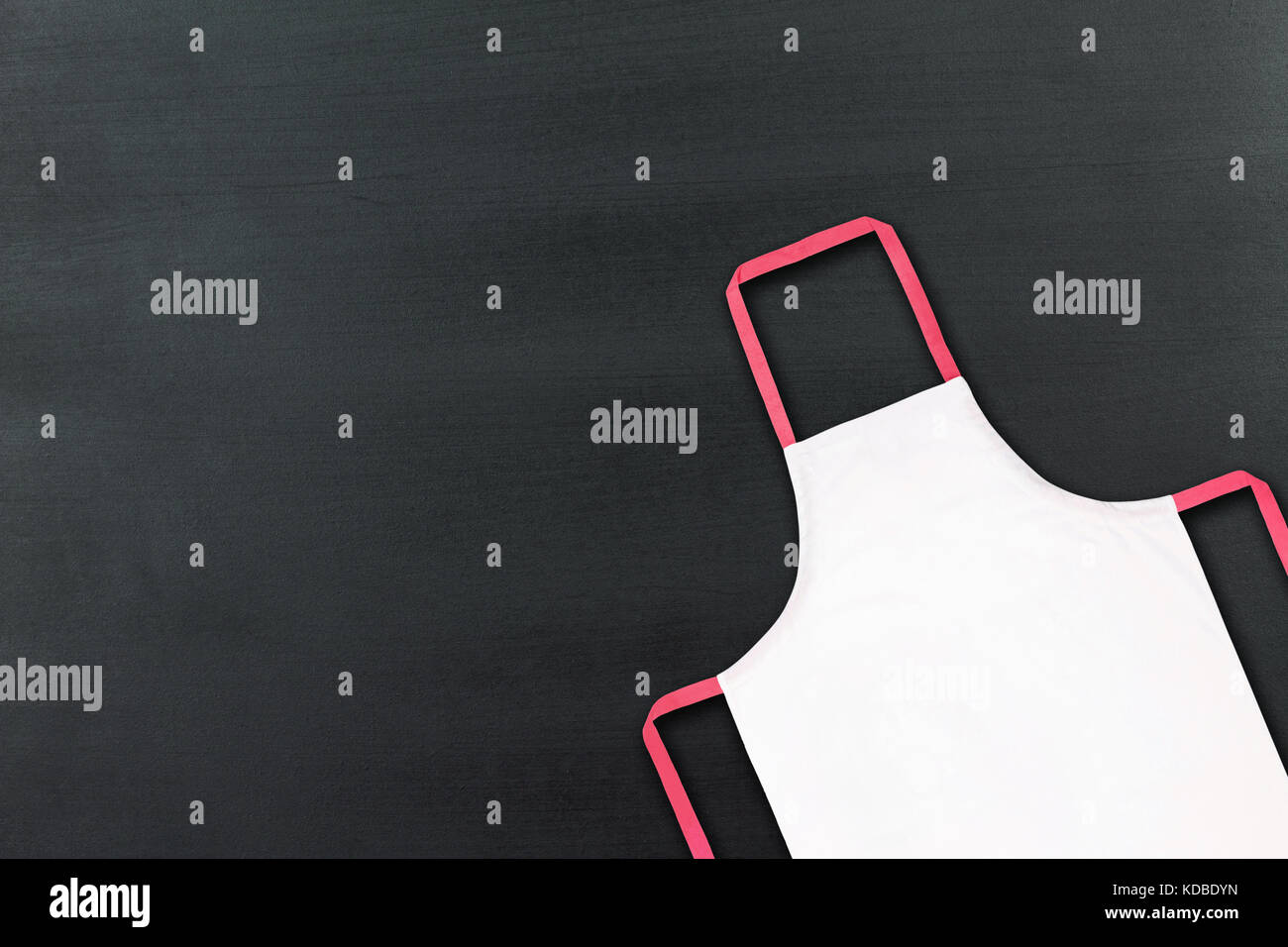 White apron on black chalkboard texture Stock Photo - Alamy
