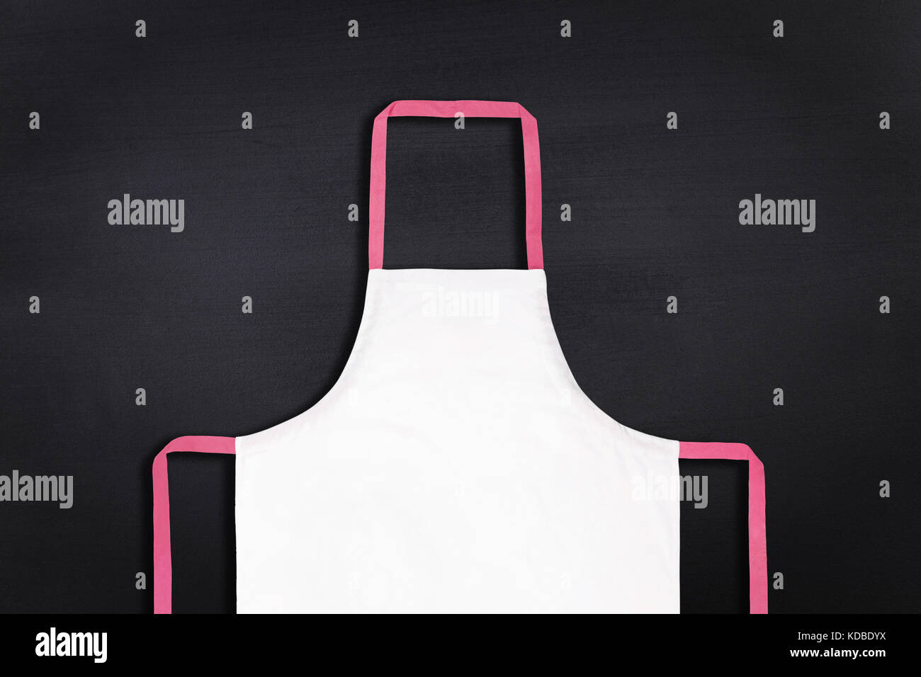 White apron on black chalkboard texture Stock Photo - Alamy