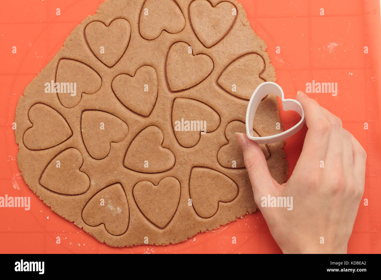 Woman making gingerbread biscuits Stock Photo - Alamy