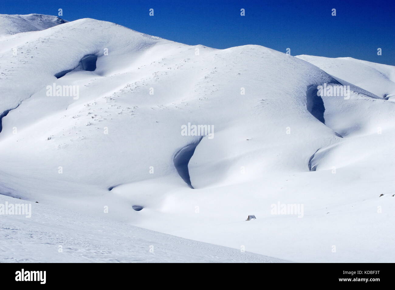 Snow covered mountains around Zljeb mountain peak on the border between ...