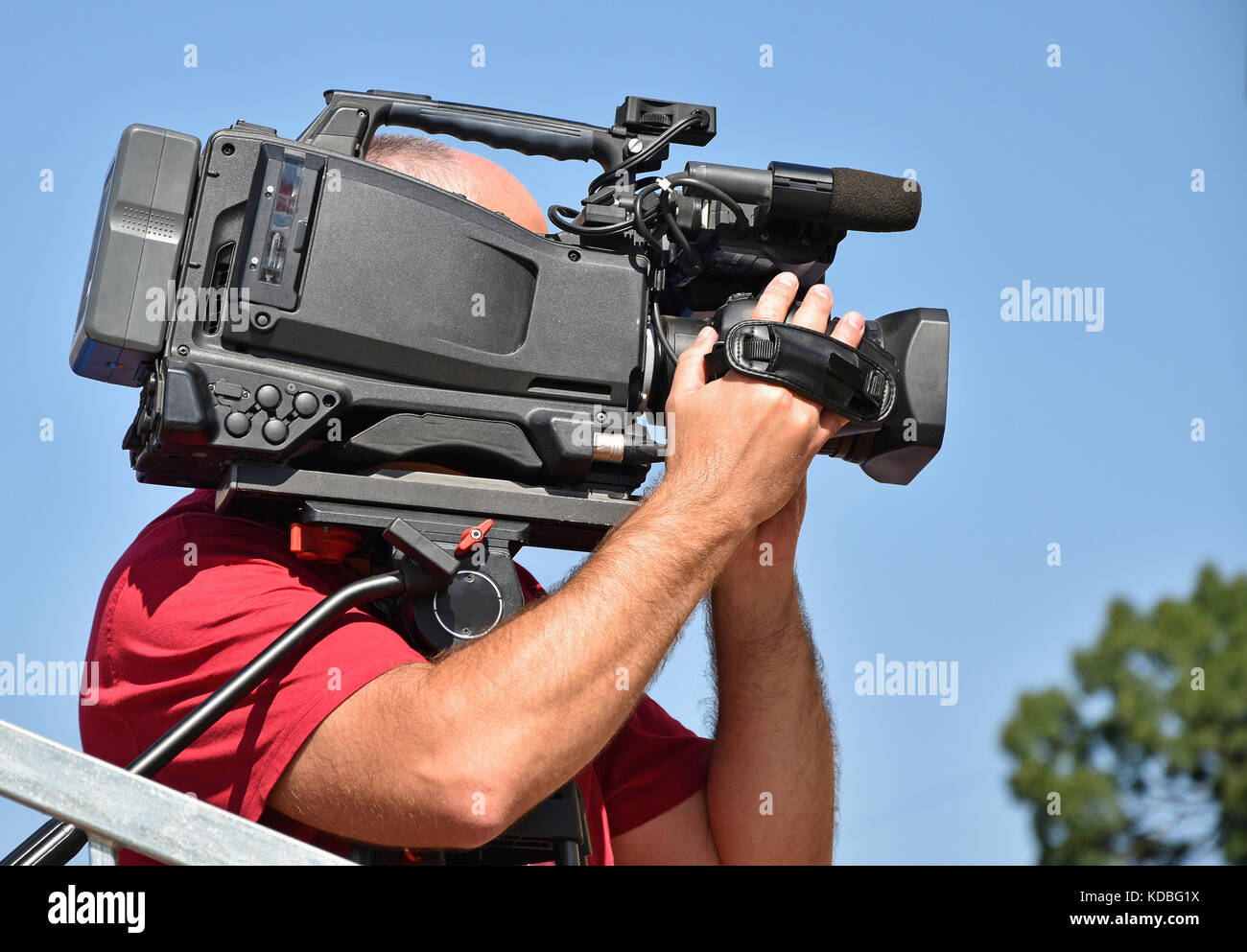 Cameraman works outdoor in summer Stock Photo - Alamy