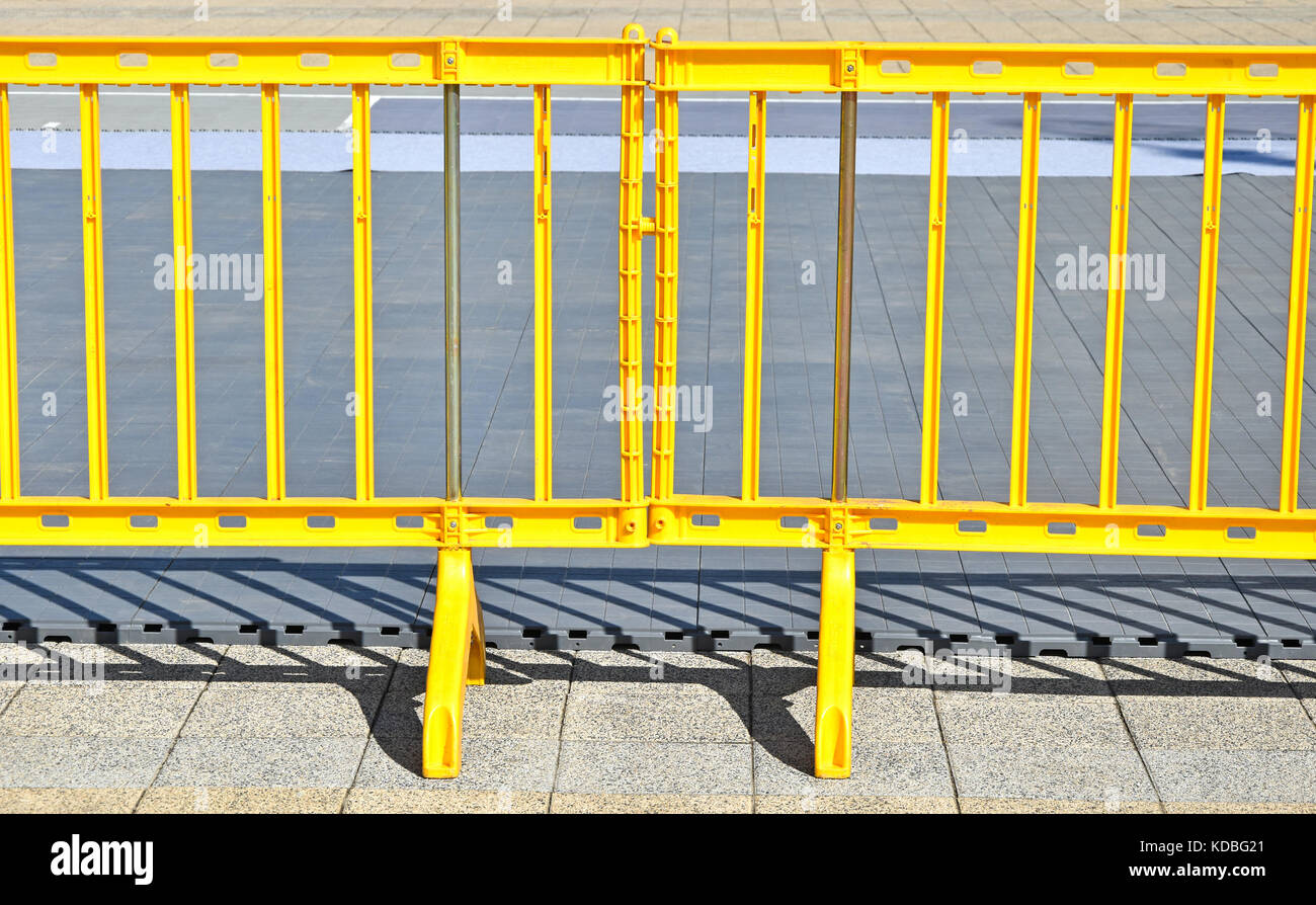 Yellow plastic fence on the street in the city Stock Photo - Alamy