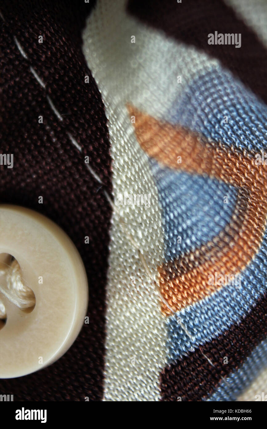 Close-up button of vintage synthetic fabric Stock Photo - Alamy