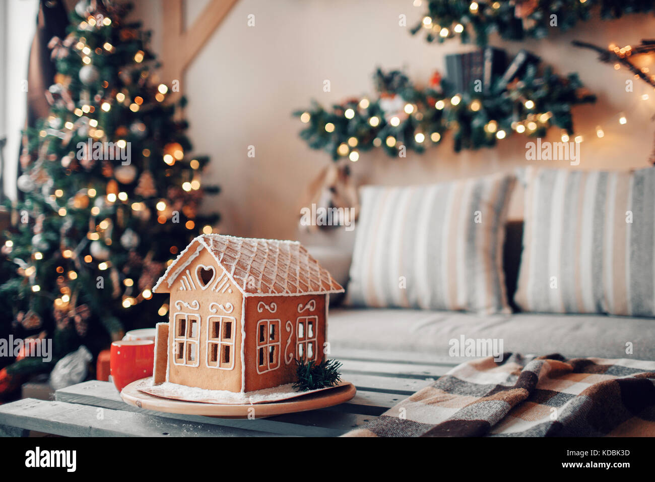 Homemade gingerbread house on light room background Stock Photo - Alamy