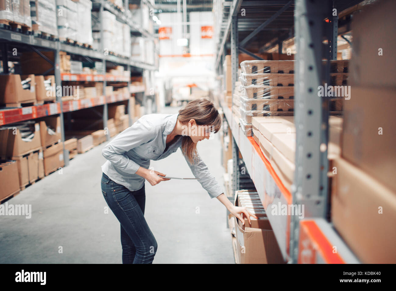 stock taking. beautiful young woman worker of furniture store Stock ...